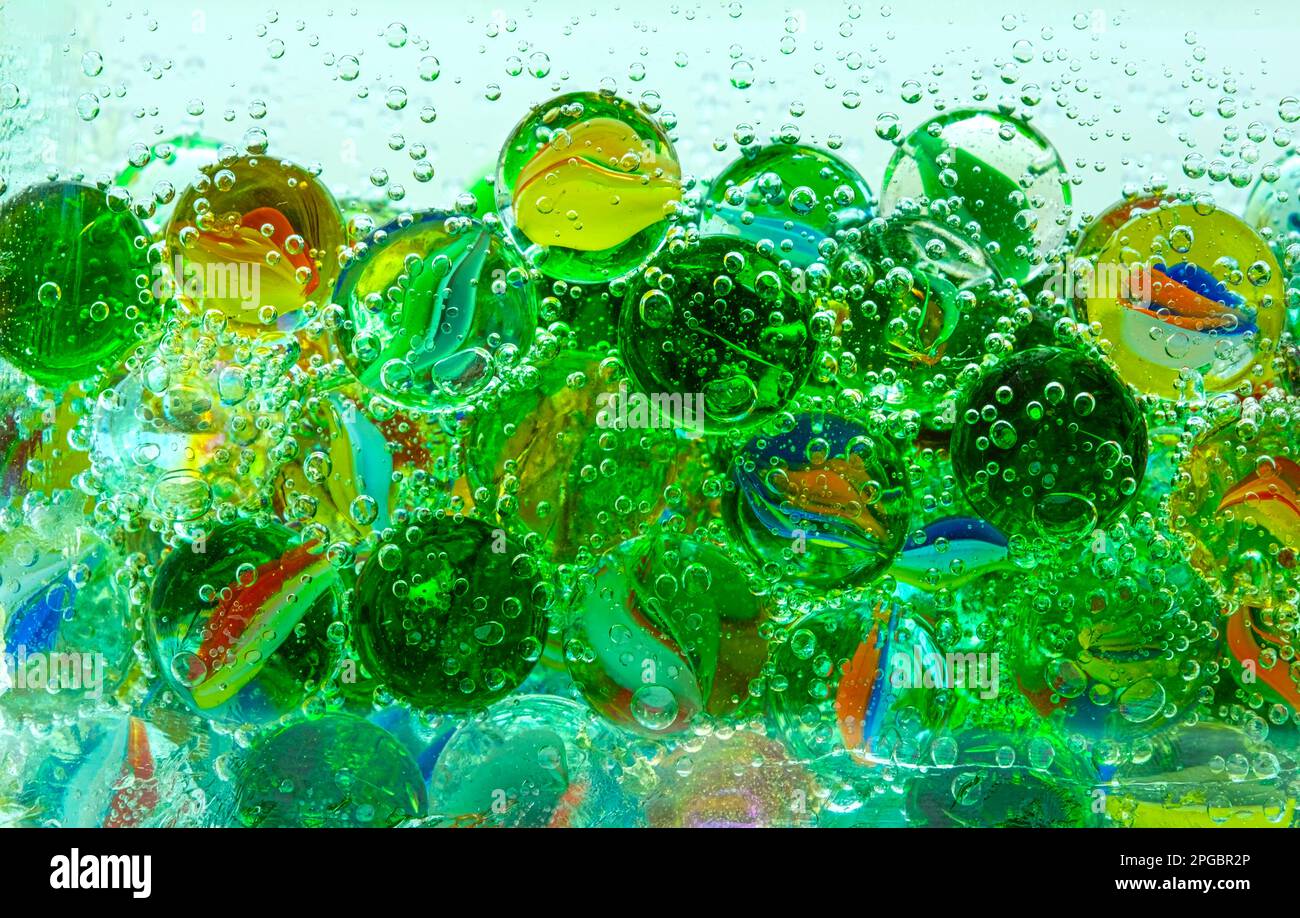 glass balls in mineral water with bubbles Stock Photo - Alamy