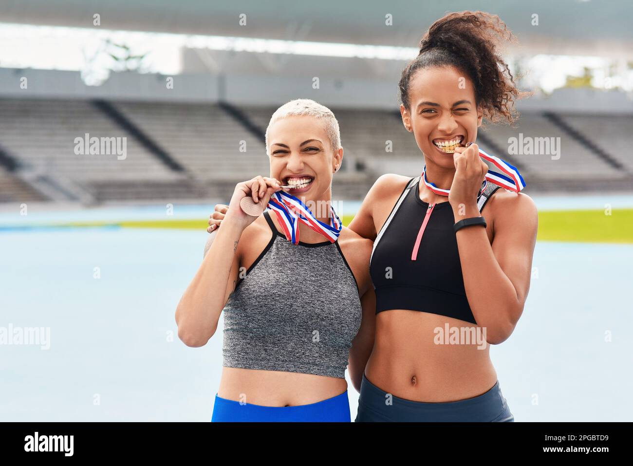 Were queens of the podium. Cropped portrait of two attractive young ...