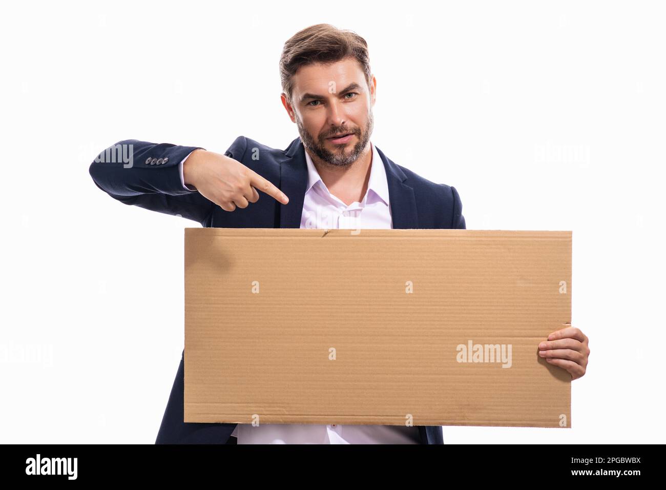 Man with blank banner isolated on studio background. Portrait of ...
