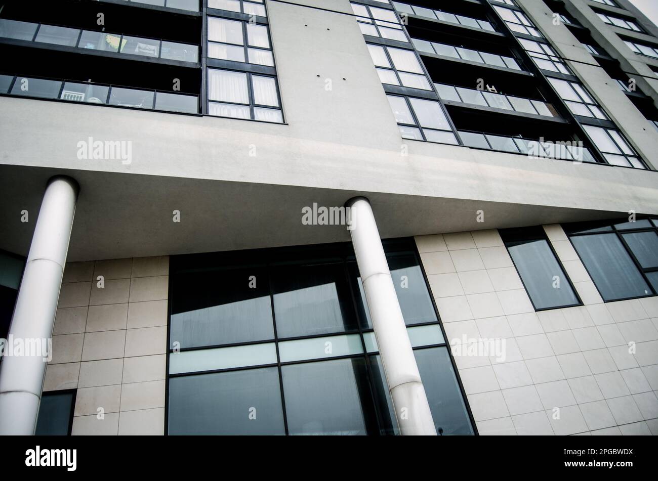 A high-rise building exterior with large rectangular windows Stock ...