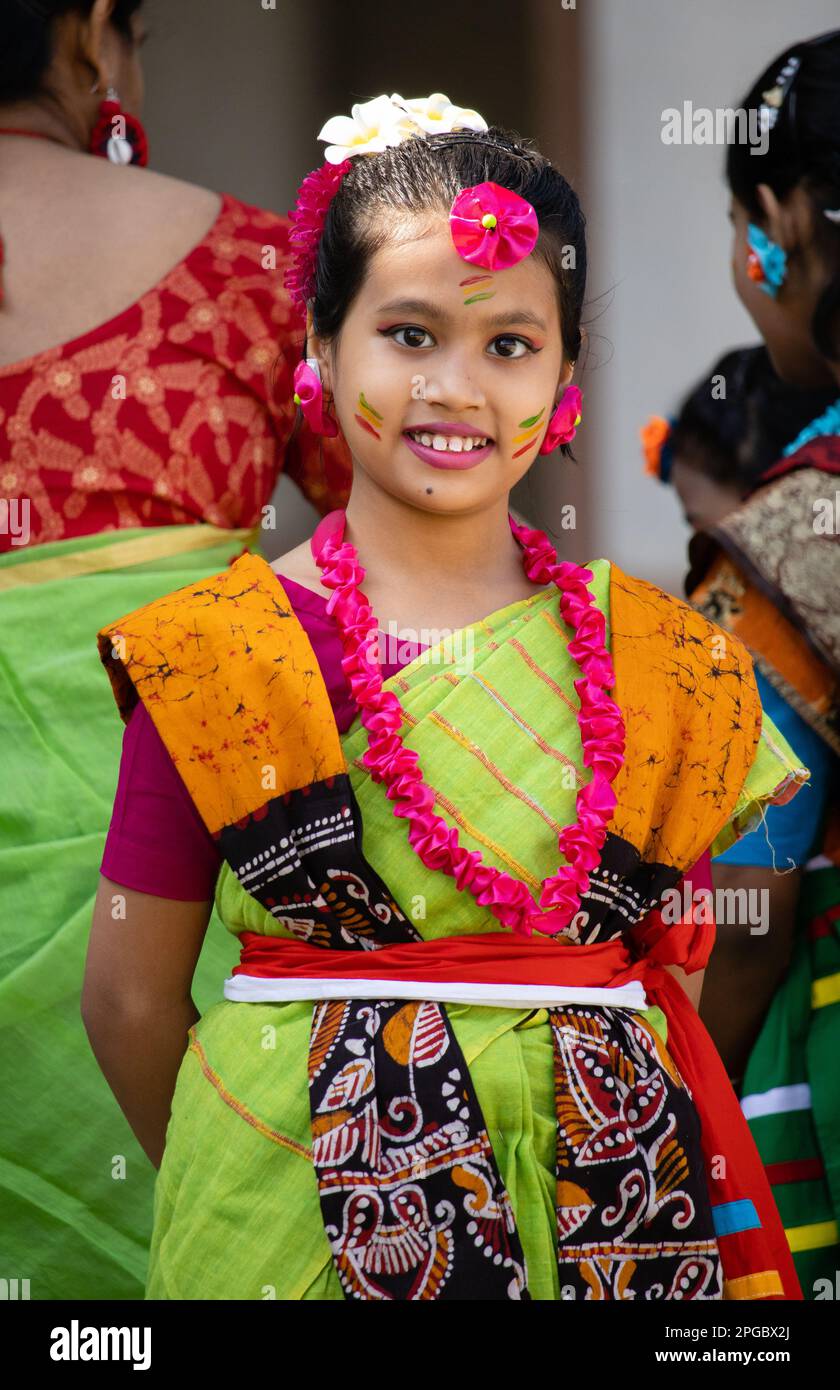 An Indian Bengli girl child with colorful face and tradition dress in ...
