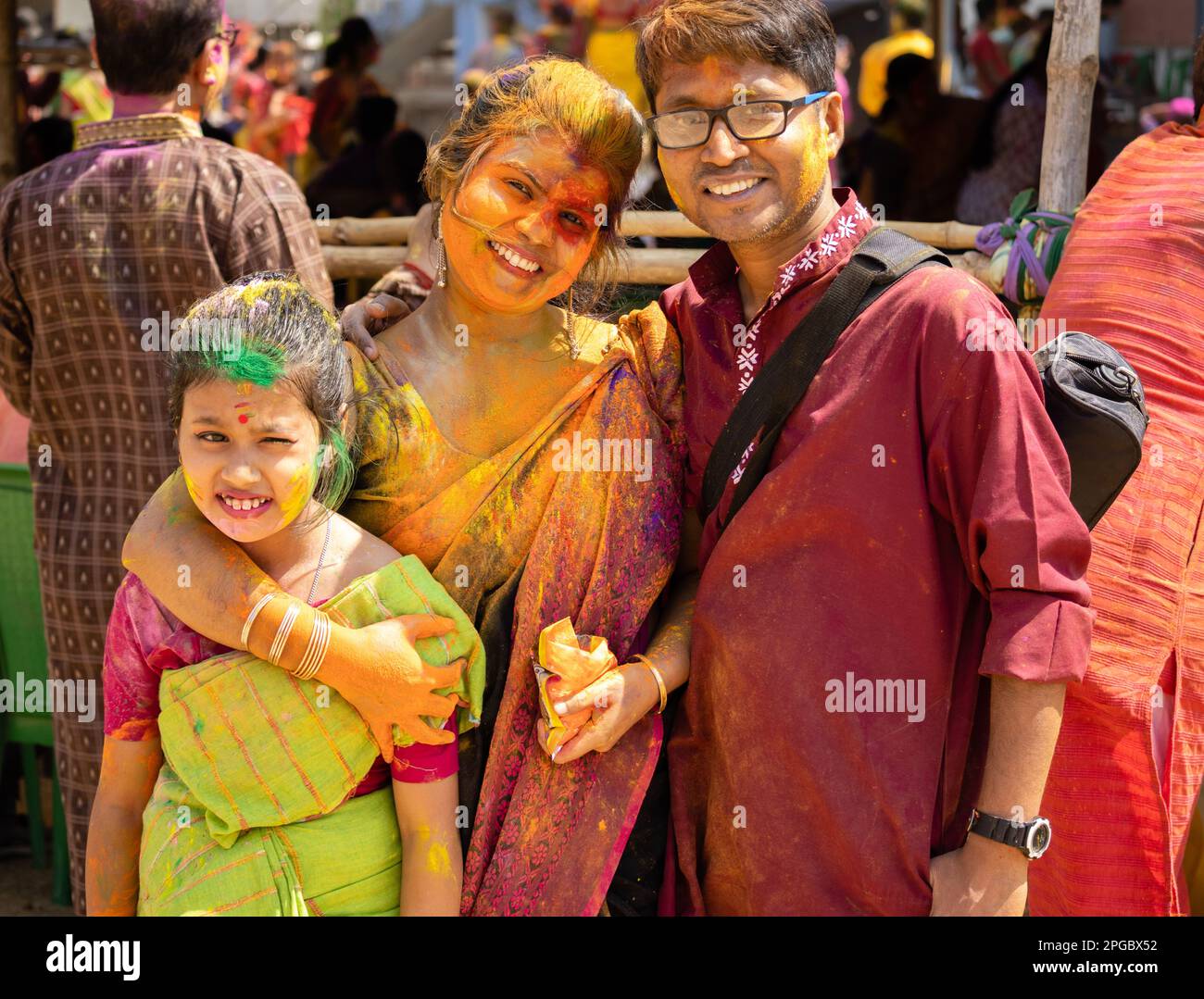 Colorful smiling faces of an Indian Bengali family in tradition dress ...