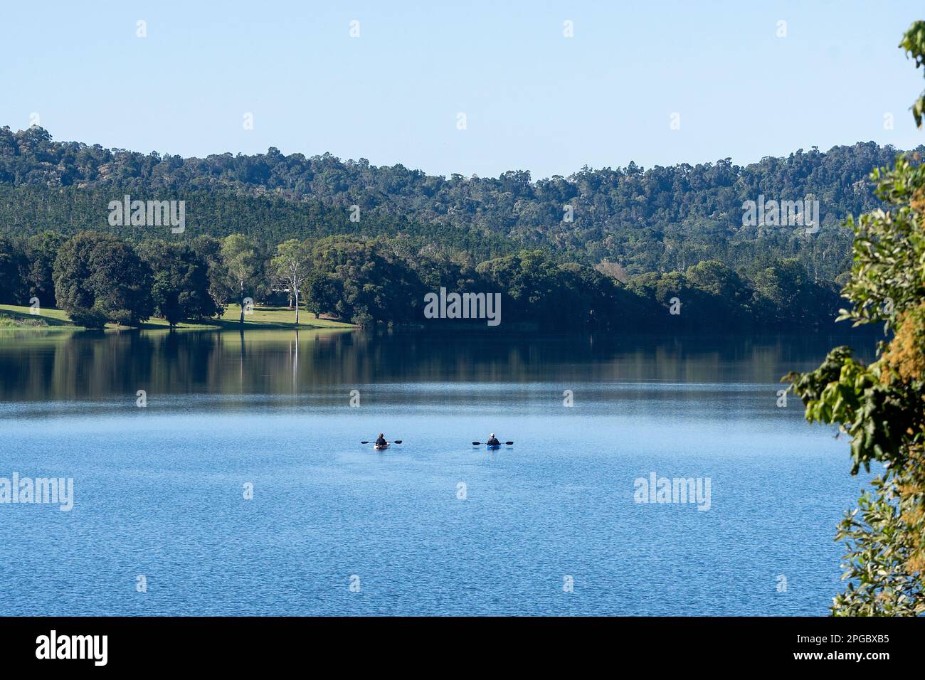 Two persons kayaking on Lake Tinaroo, a popular scenic tourist ...