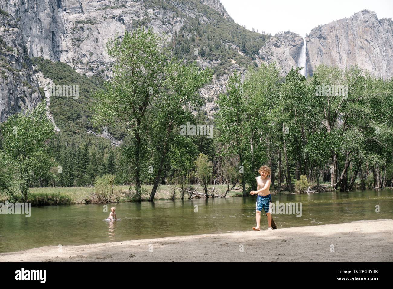 Boys playing in river at Yosemite National Park Stock Photo - Alamy