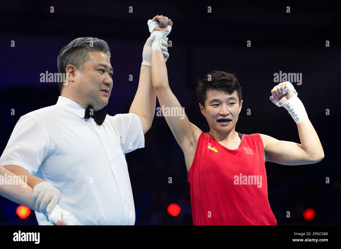 New Delhi, India. 21st Mar, 2023. Yang Wenlu (R) of China is declared ...
