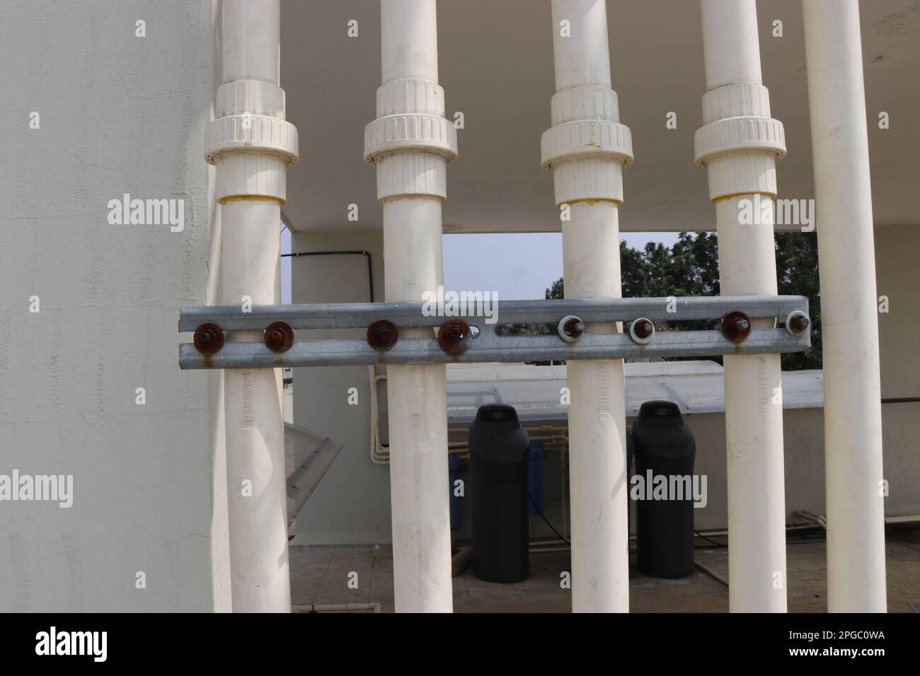 Water supplying pipelines placed vertically in a group with metal ...