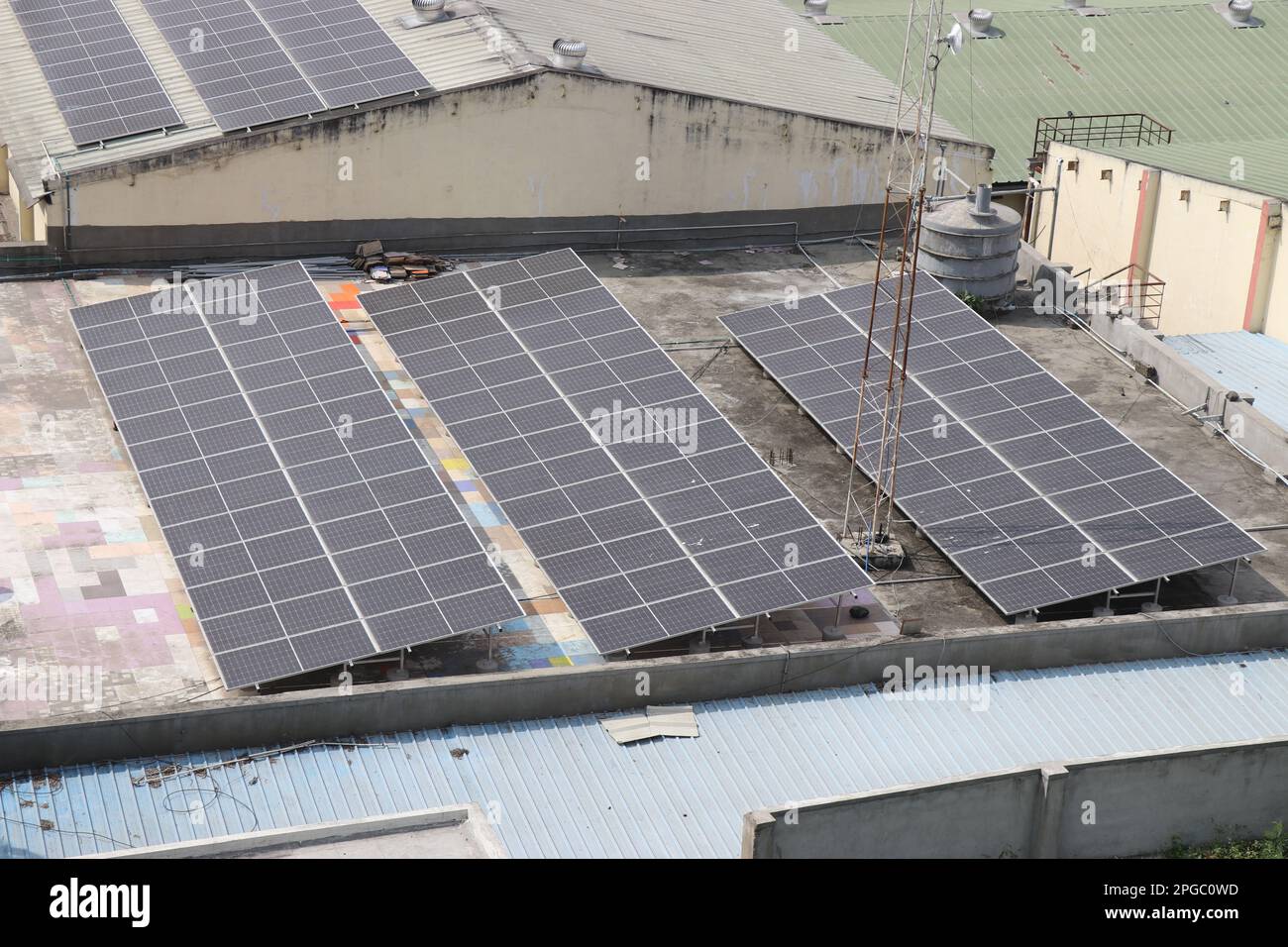 Solar panels on roof top of an old building showing the concept of ...