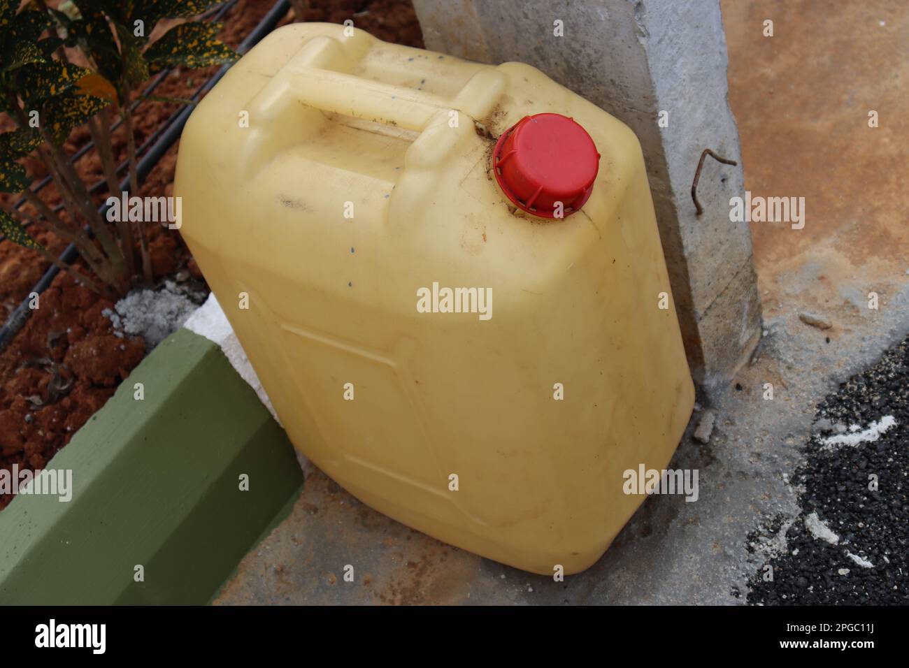 Old Plastic Can Used To Carry Or Store Liquids Placed Near concrete ...