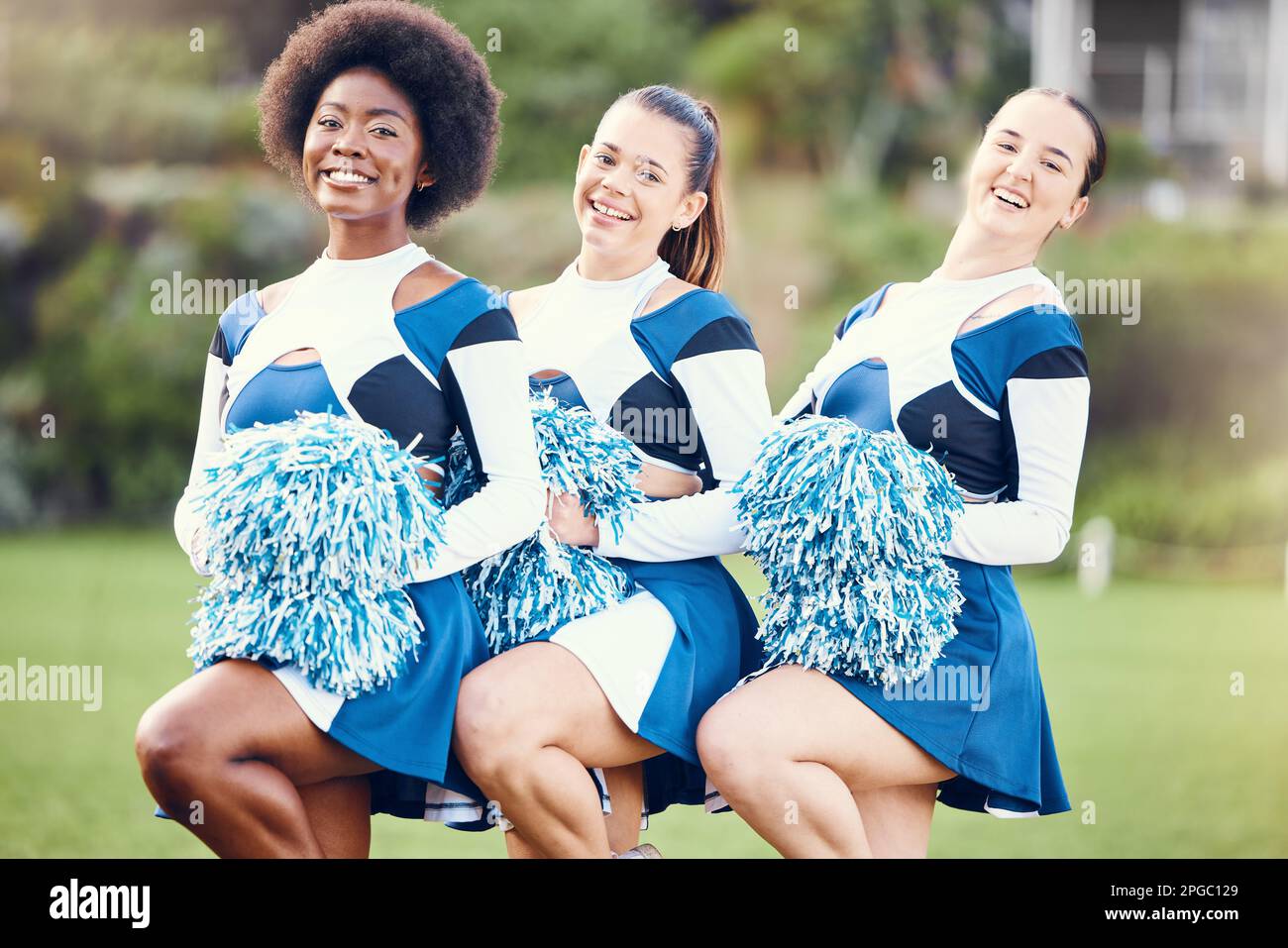Cheerleader group portrait, field and women together for teamwork ...