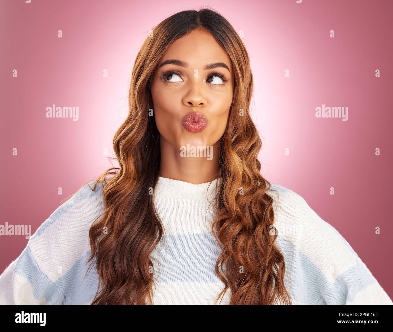 Kiss, face and studio with a woman with kissing, love and emoji expression feeling silly ...