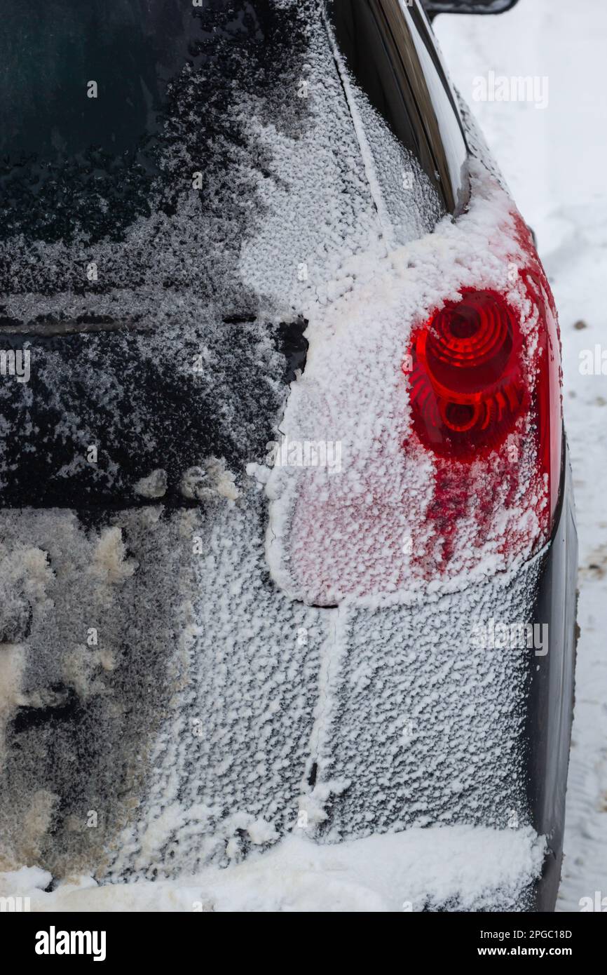 rear tail light of car covered in snow after blizzard on winter Stock ...