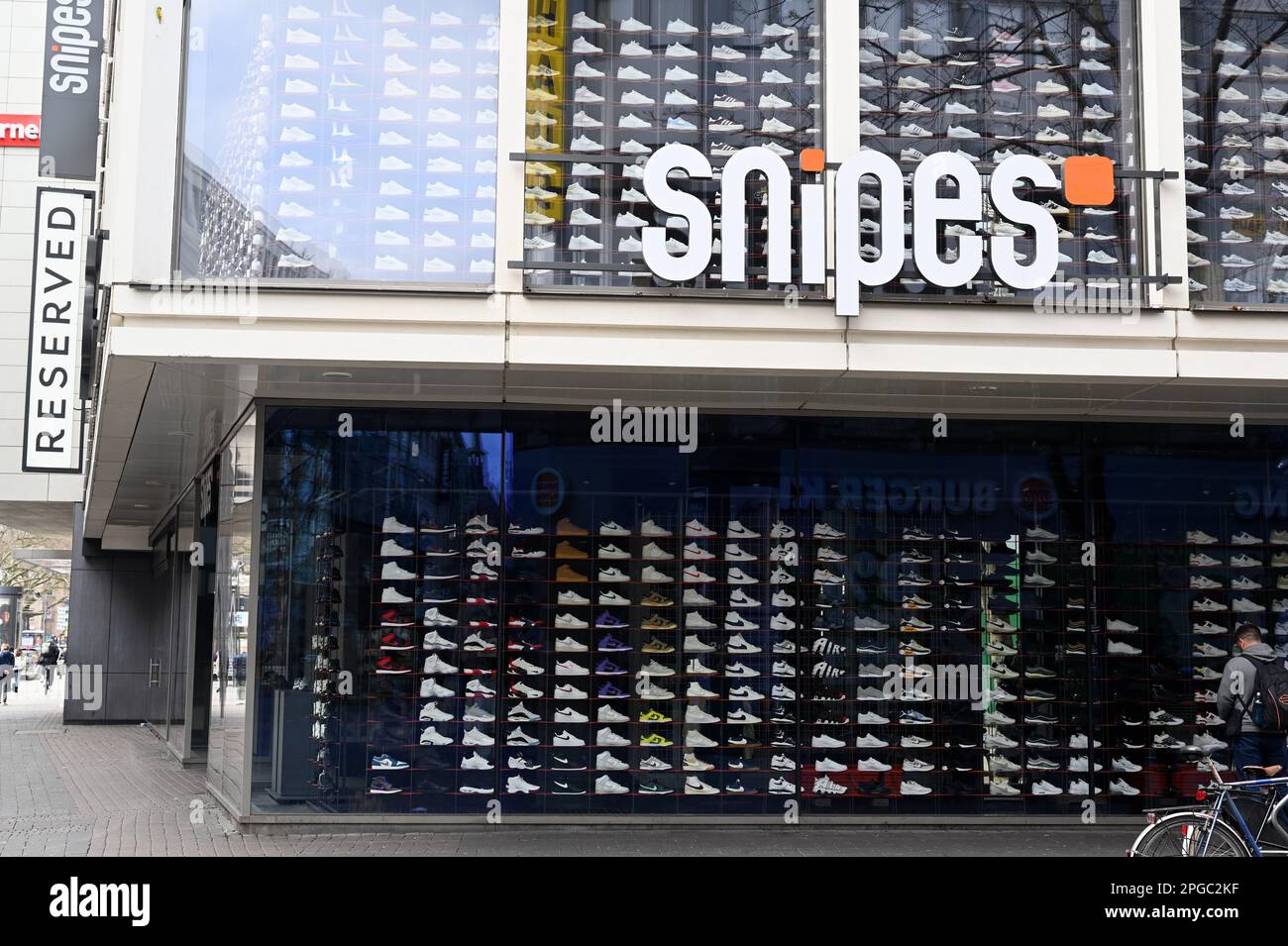 Cologne, Germany. 19th Mar, 2023. Logo, lettering on a branch of Snipes ...