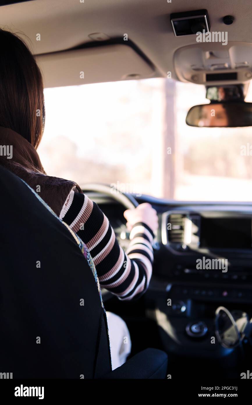 rear view of a young woman driving her camper van Stock Photo - Alamy