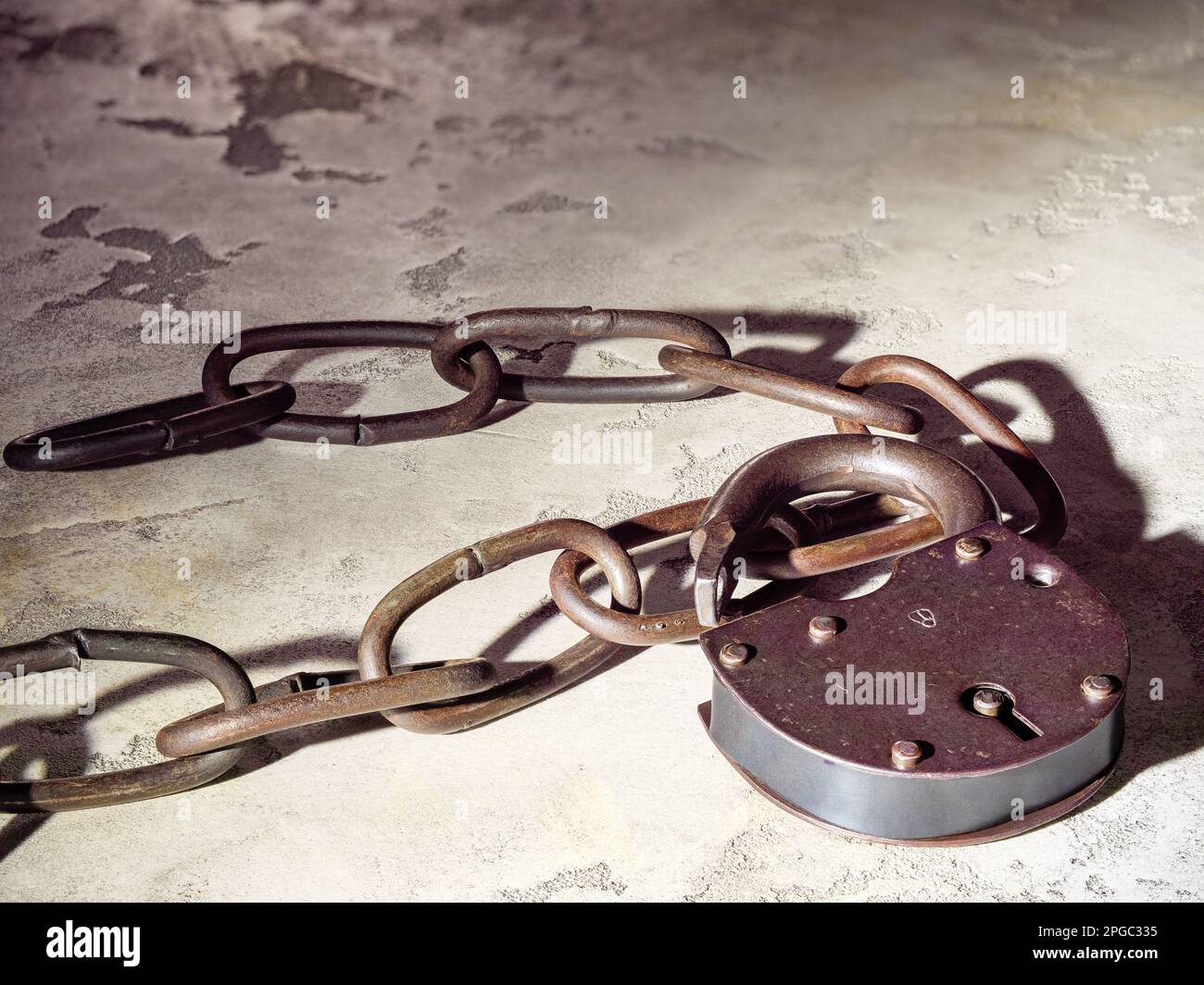 Old rusty link chain and padlock on concrete background, metal texture ...