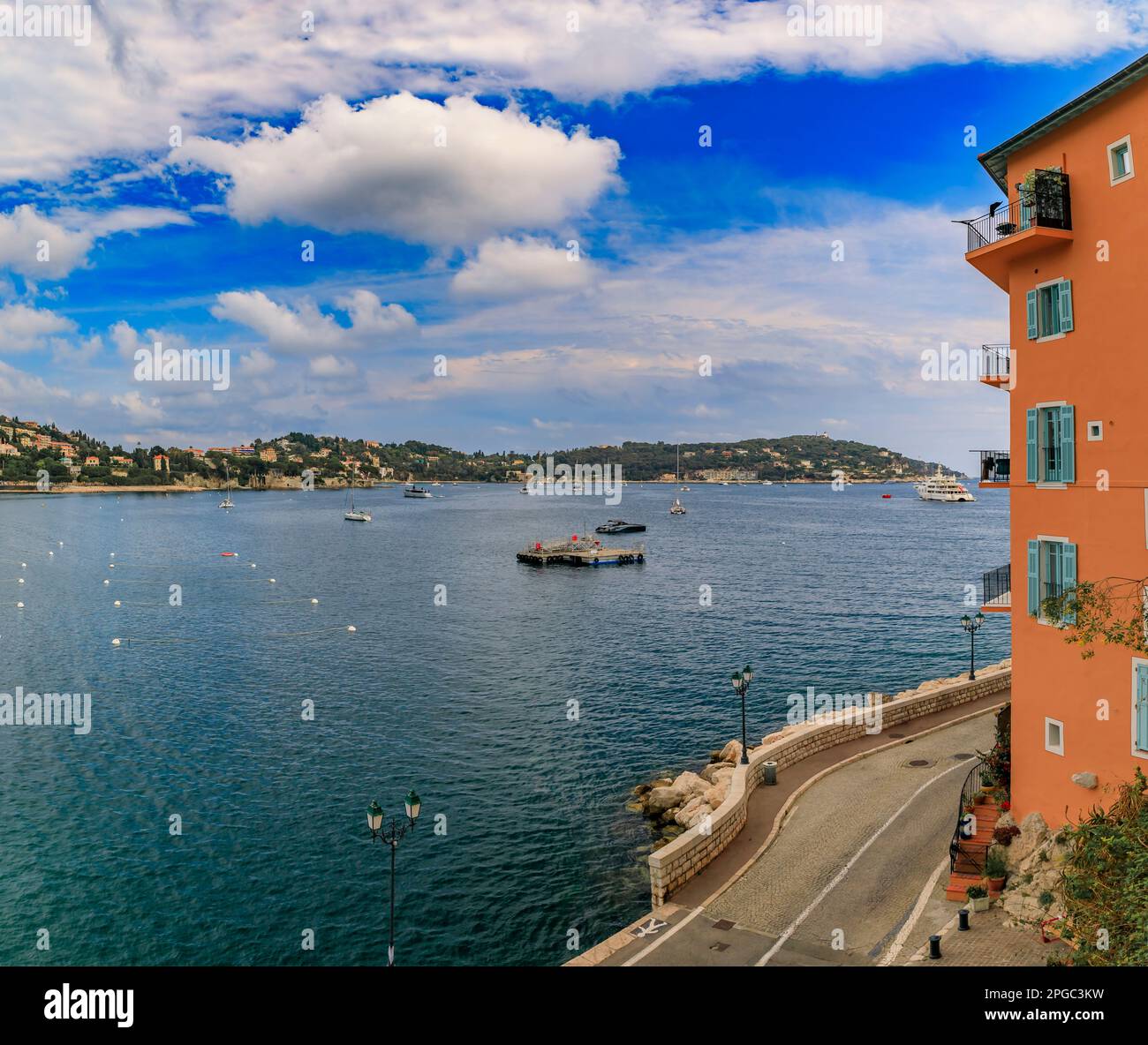 Traditional old terracotta houses on a cliff above the Mediterranean ...