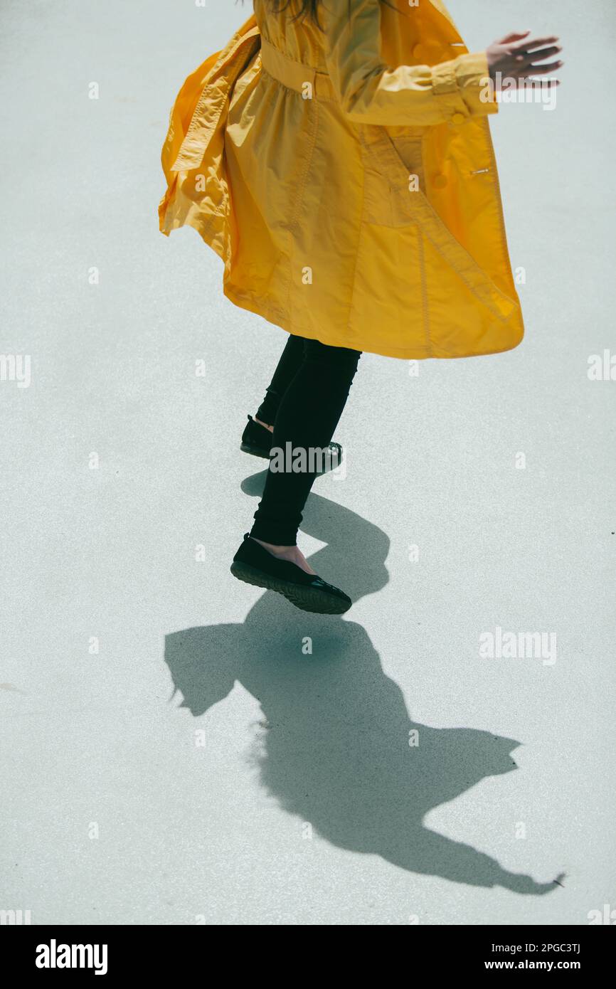 High angle view of woman in danger running away Stock Photo - Alamy