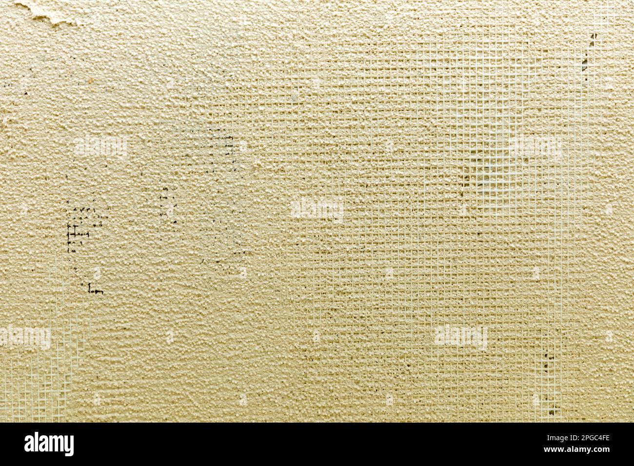 plastering a new modern house wall with plastic grid on a PVC ...