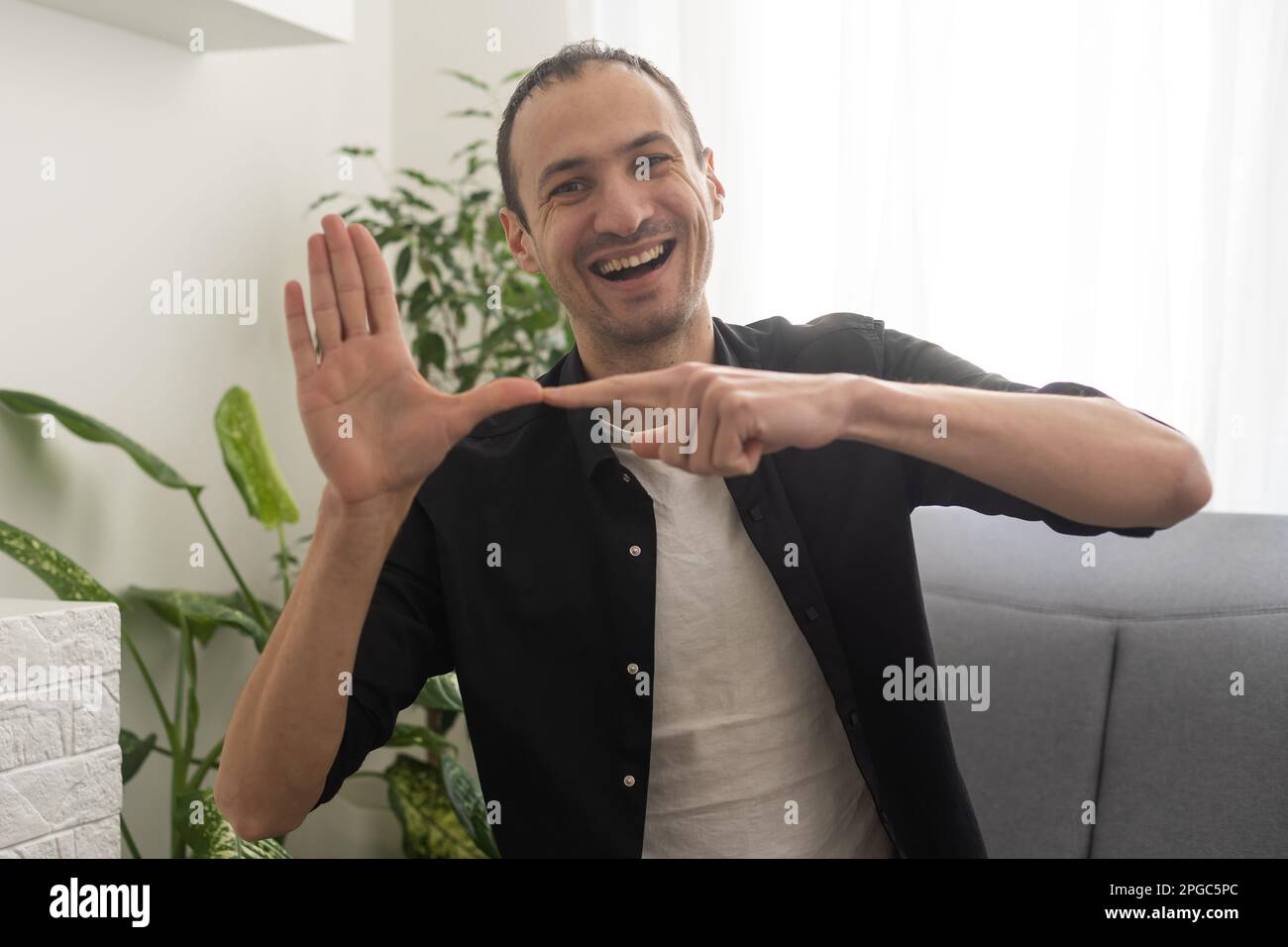 Adult Learning Sign Language For Deaf Disabled Stock Photo - Alamy