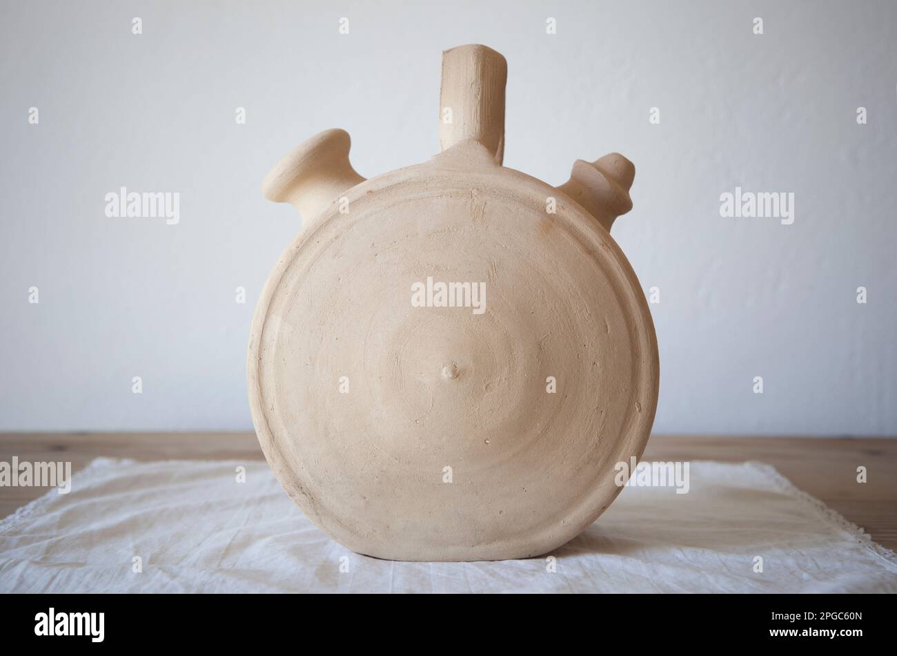White earthenware botijo, traditional clay pot jug to keep fresh water ...