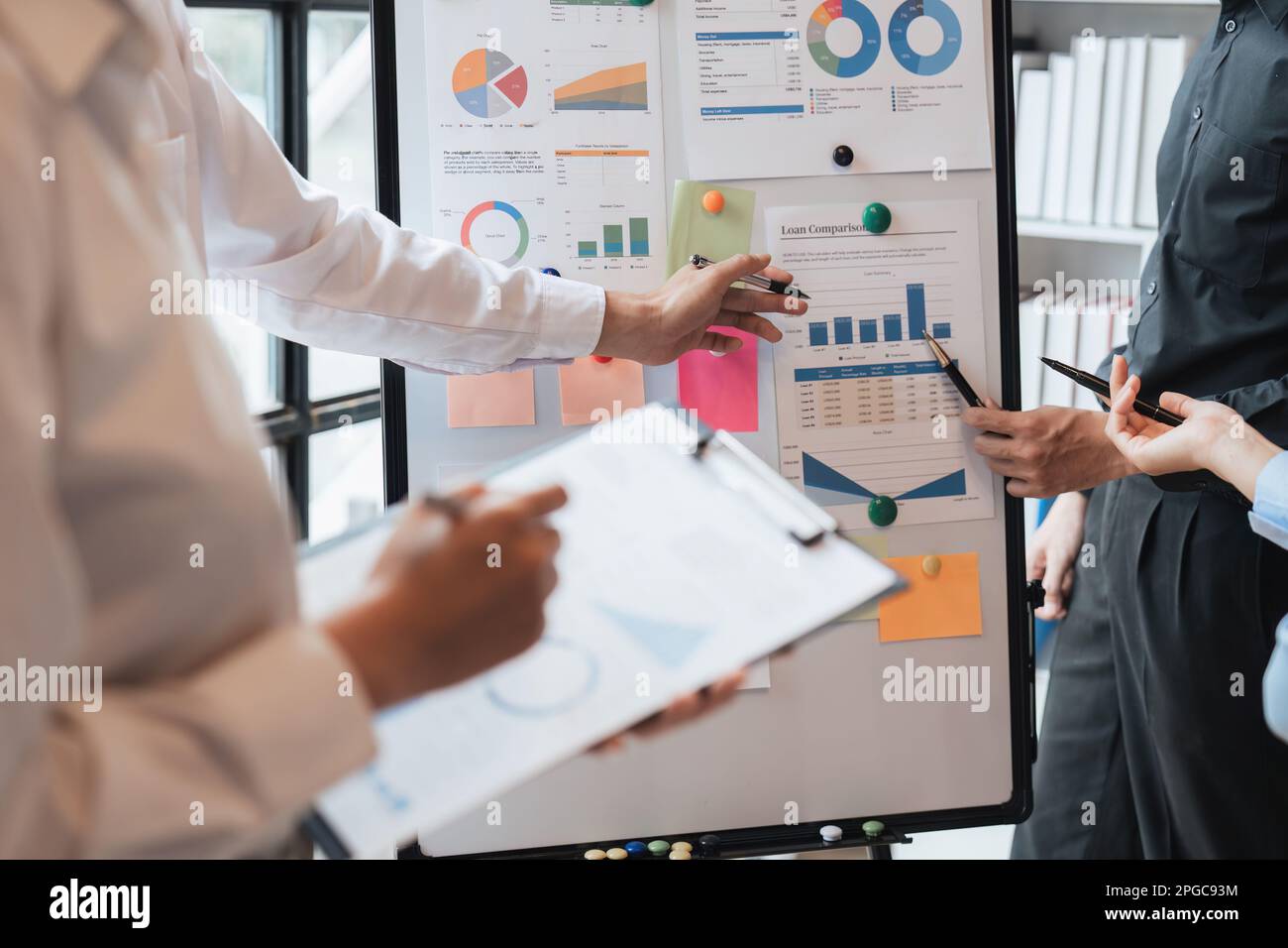 Team work process. Marketing strategy brainstorming on board. Paperwork ...