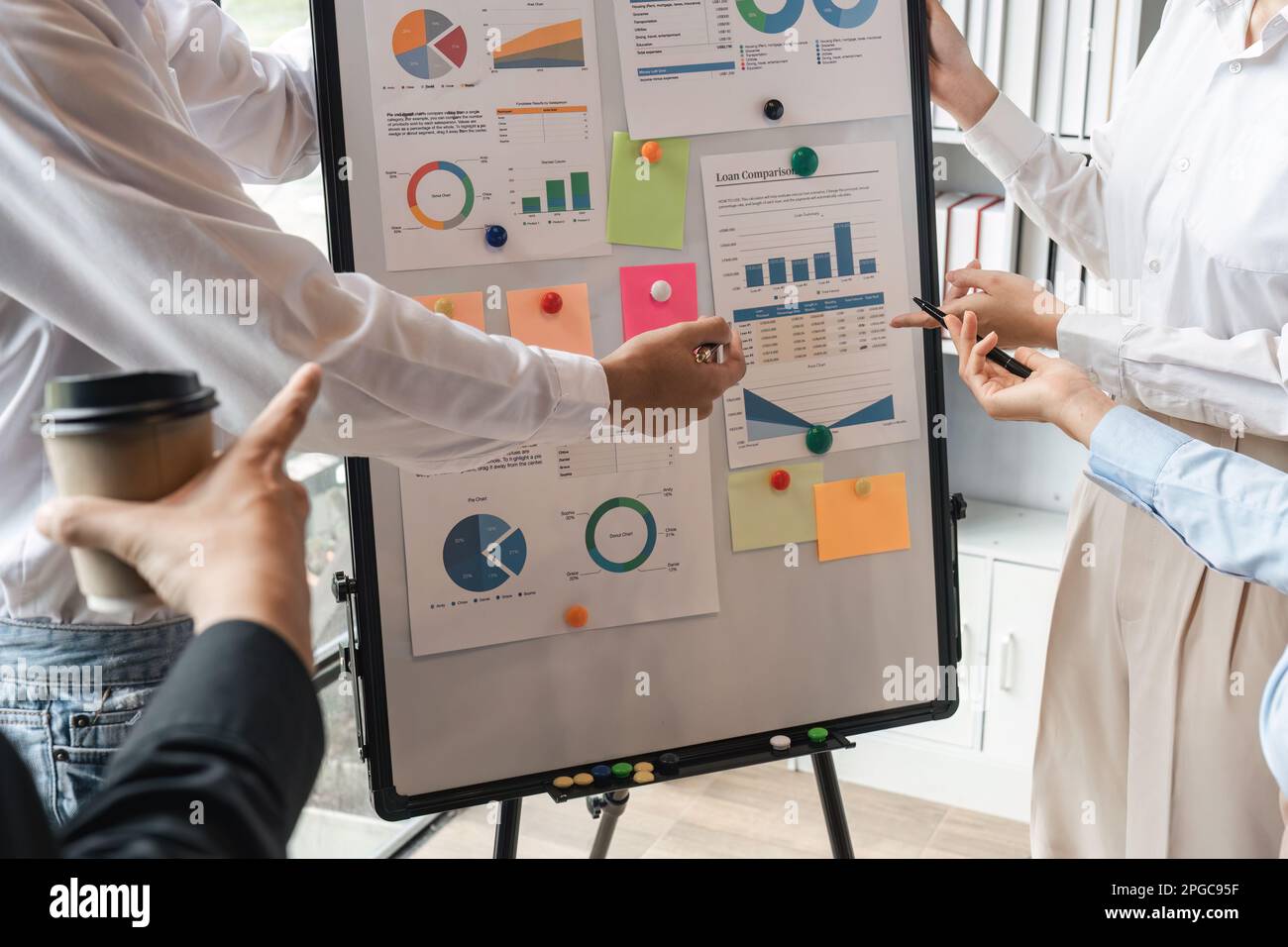 Team work process. Marketing strategy brainstorming on board. Paperwork ...