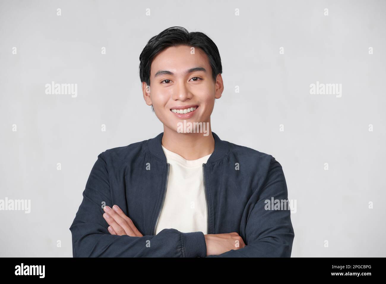 normal young man standing on a white background Stock Photo - Alamy