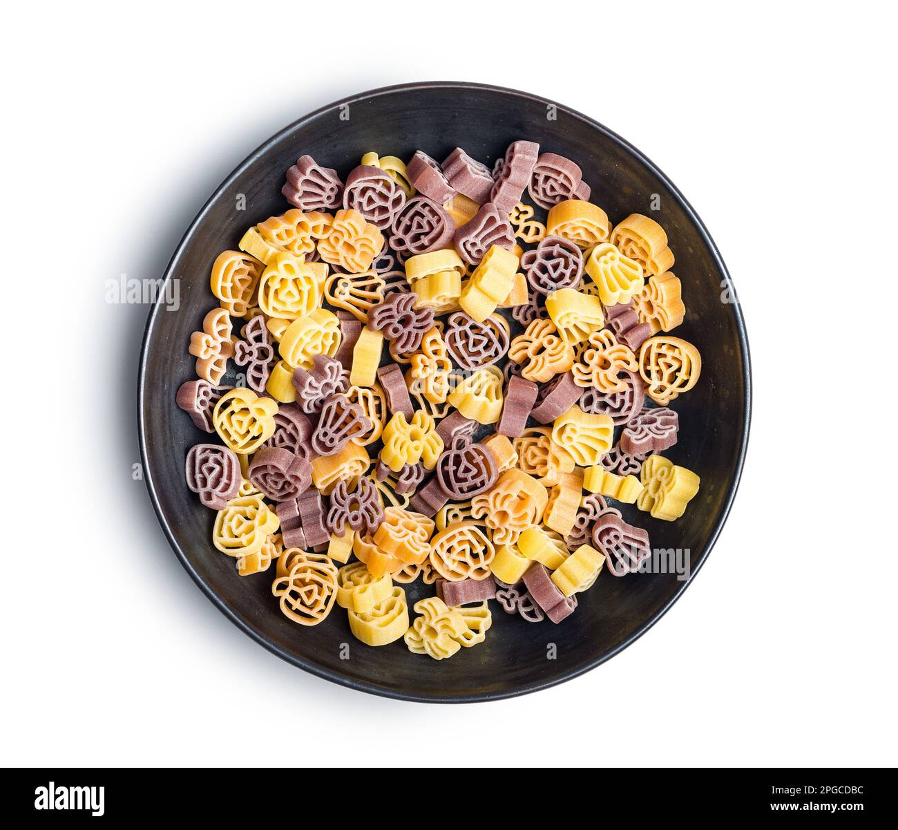 Pasta of various scary shapes. Uncooked halloween pasta in the plate ...
