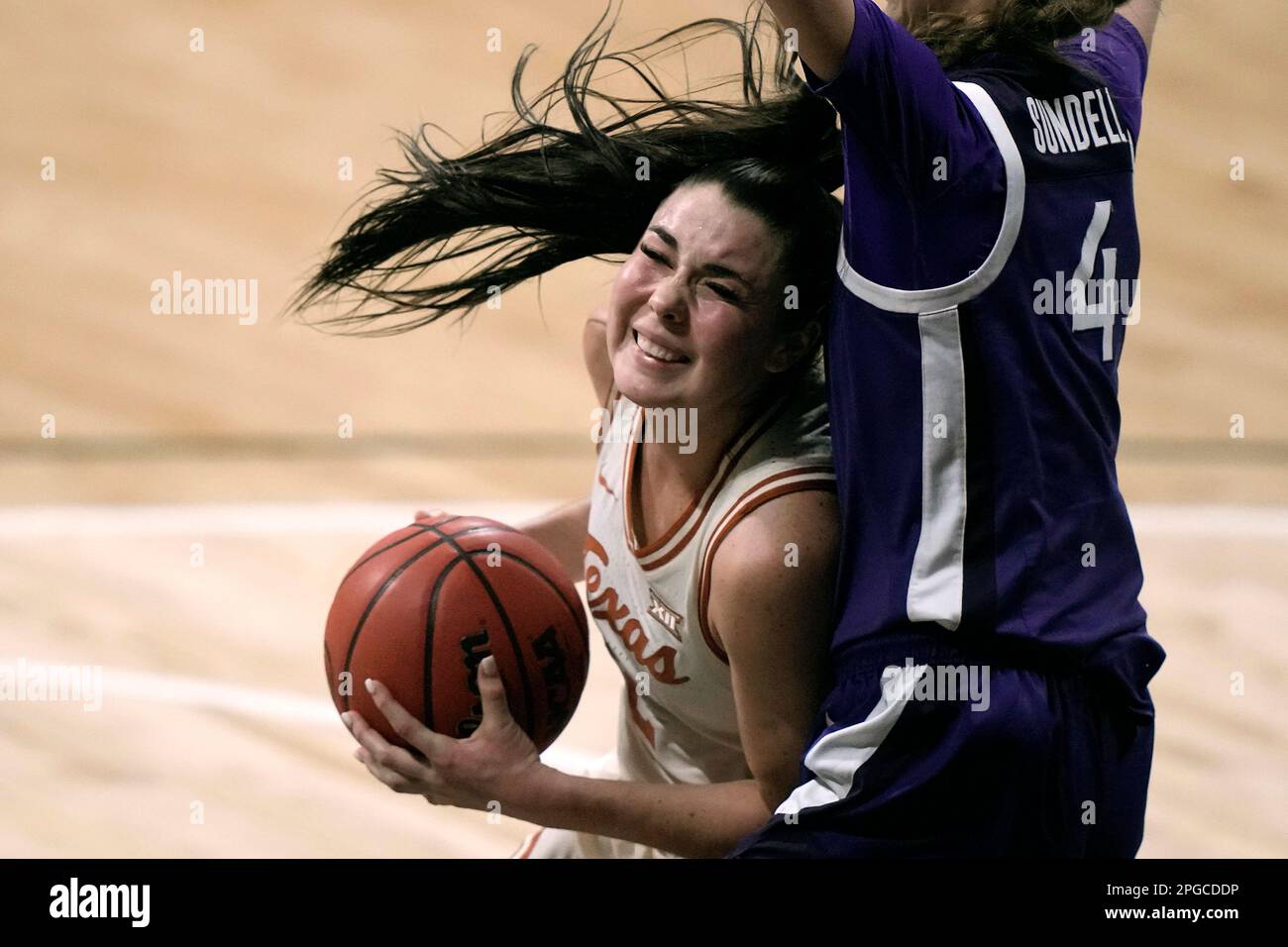 Texas guard Shaylee Gonzales, left, looks to shoot around Kansas State ...