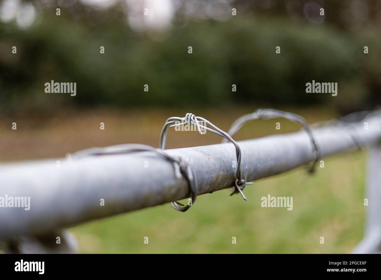 Locks, gates and barbed wire Stock Photo - Alamy