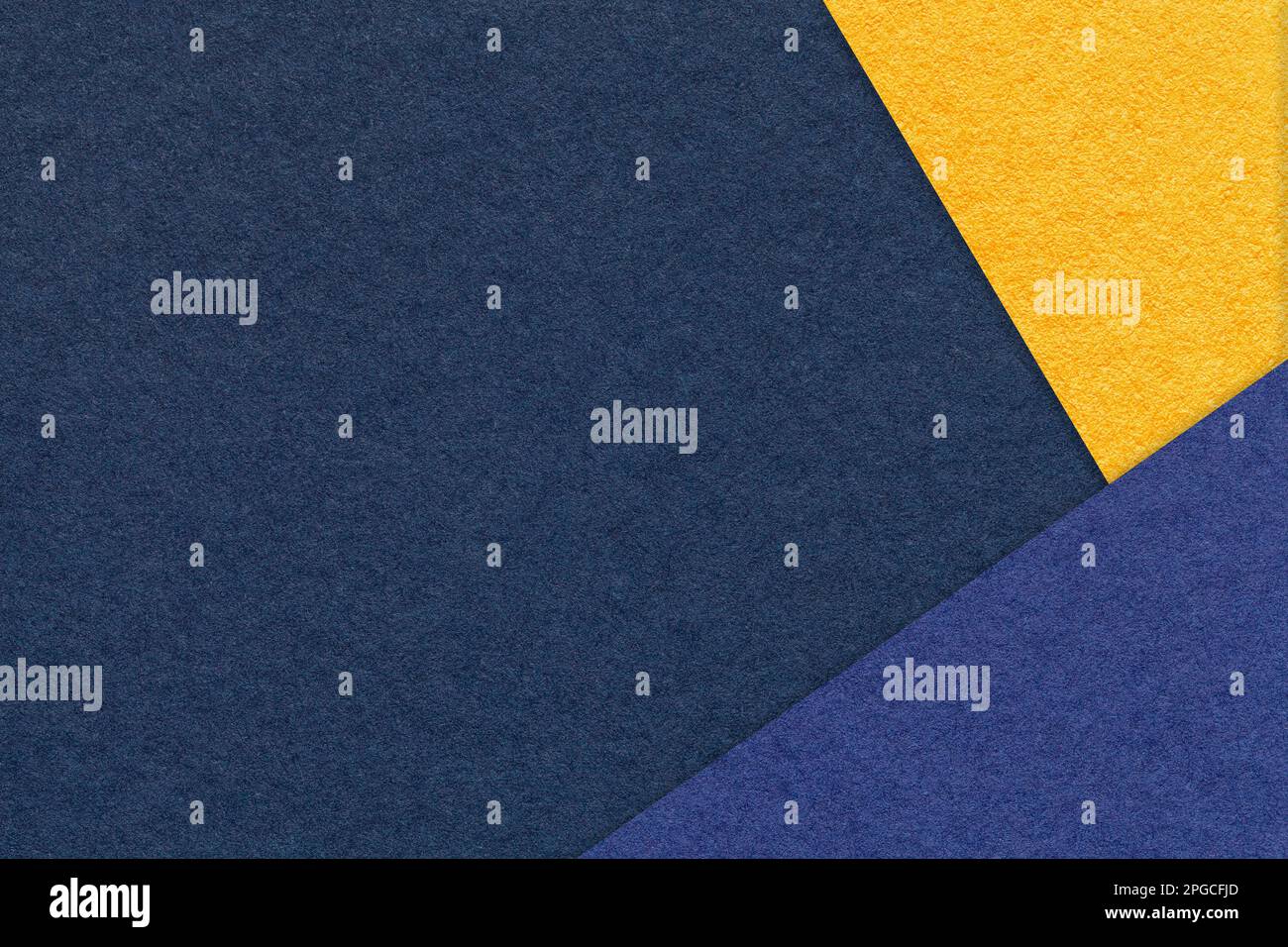 Texture of craft navy blue color paper background with denim and yellow ...
