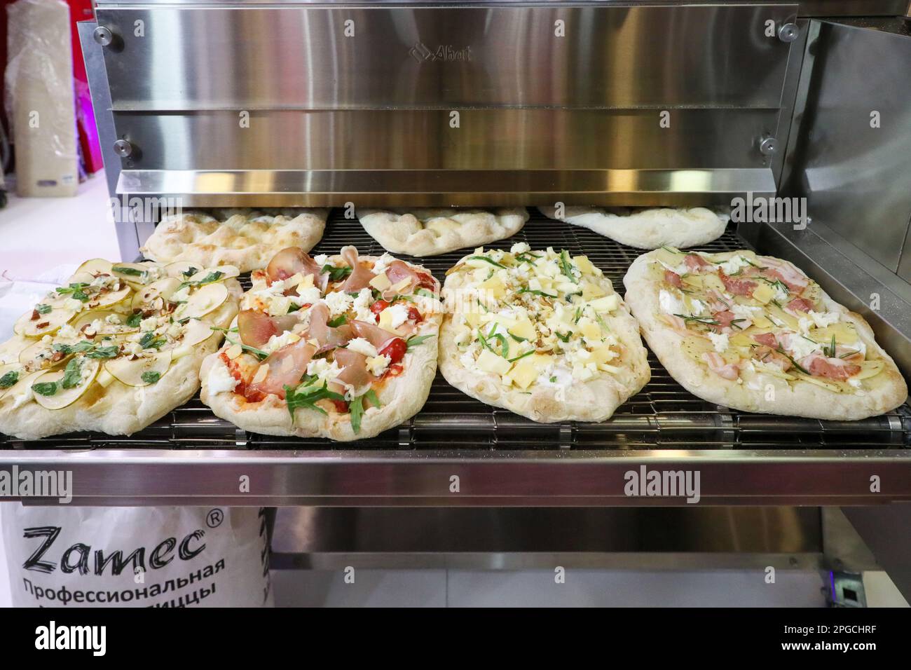 21.03.2023. Russia. Moscow. Pizza preparation at the international ...