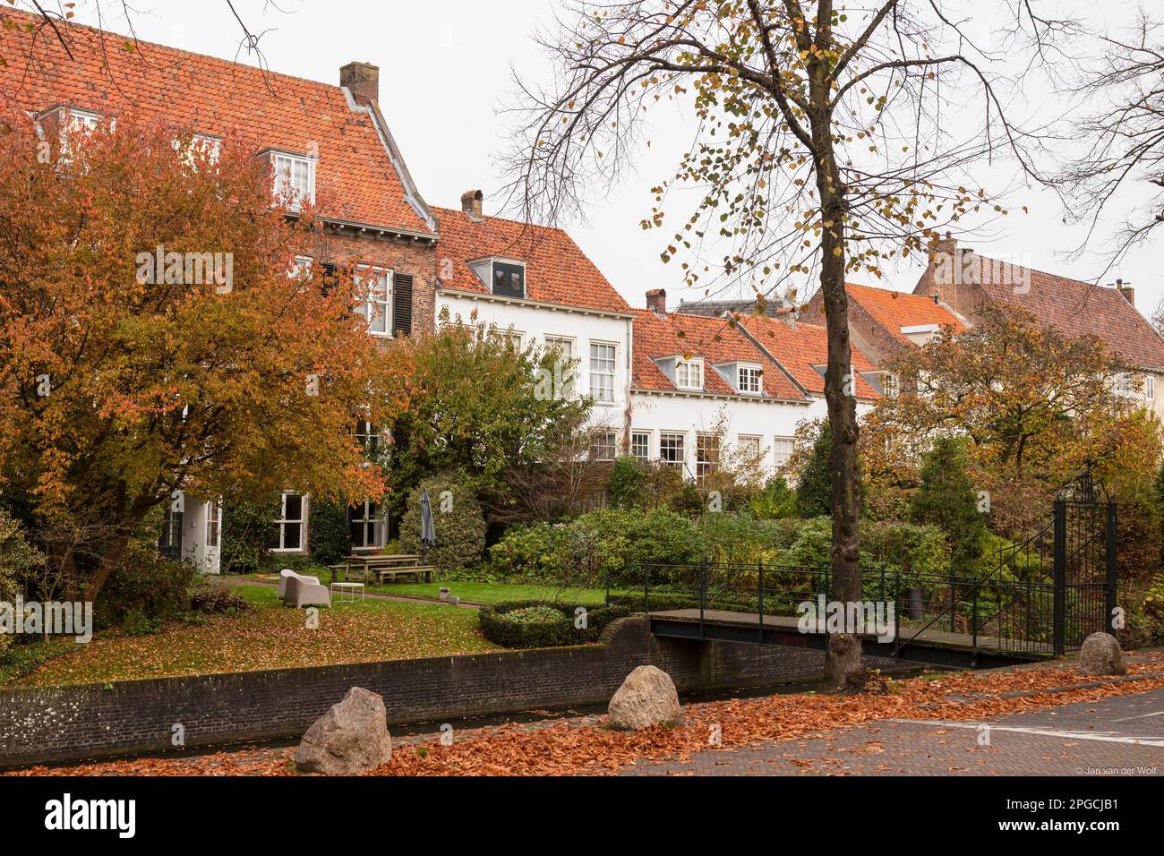 Stately monumental houses along the canal in the center of the medieval ...