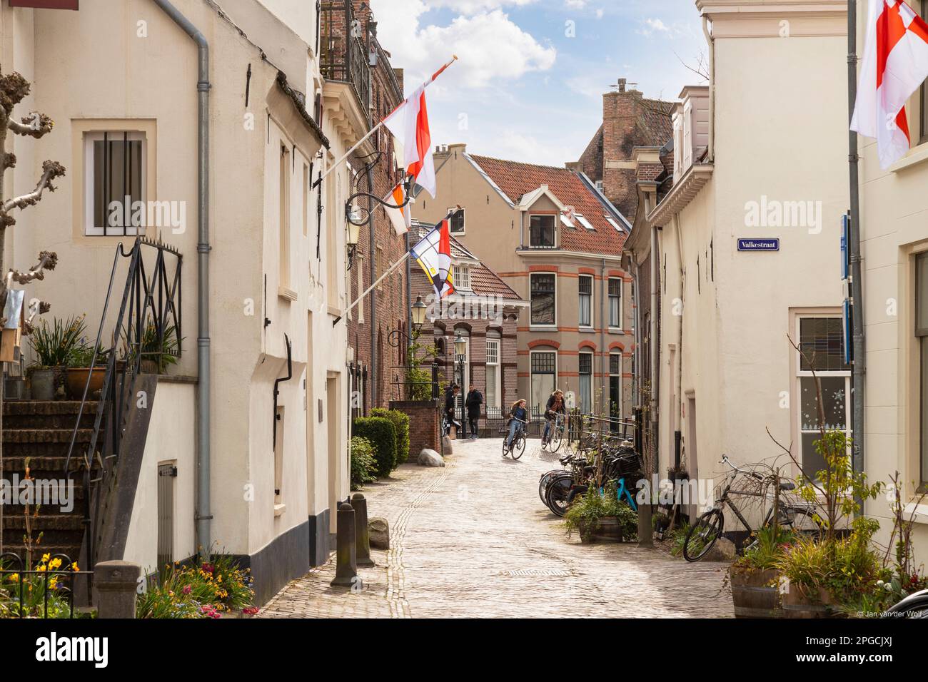 Narrow street with Mondriaan flags in the old medieval center of the ...