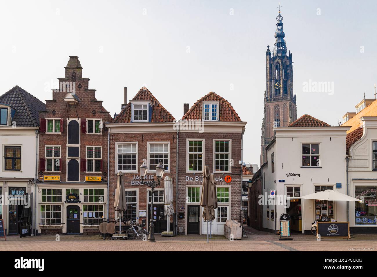 view of old monumental buildings and in the background Our Lady tower ...