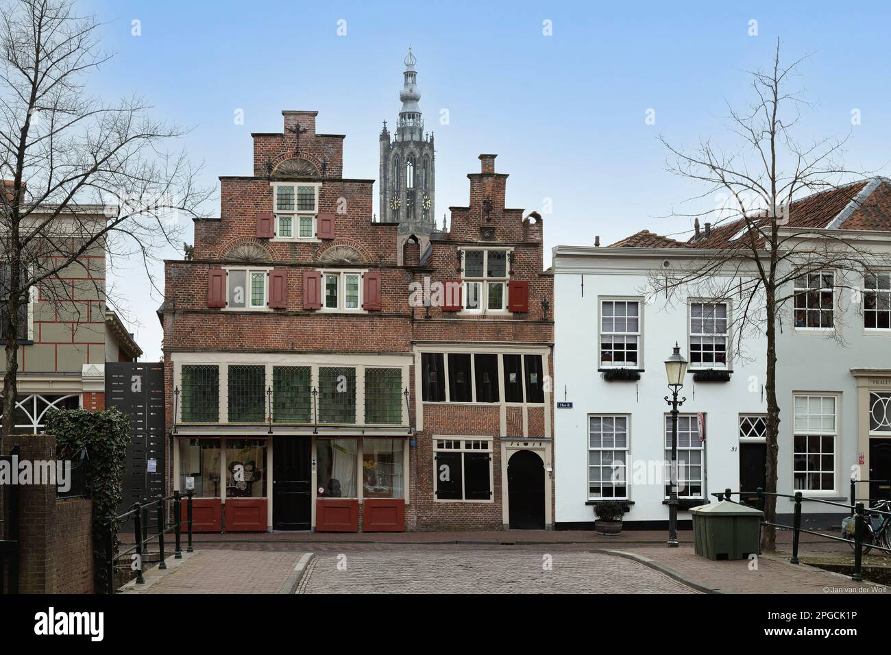 Old monumental canal houses with Onze Lieve Vrouwe tower in the ...