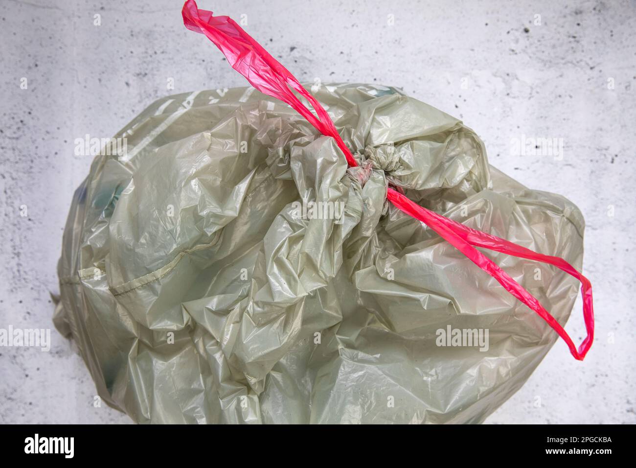 green plastic garbage bag for plastic waste, ready to recycle, waste ...