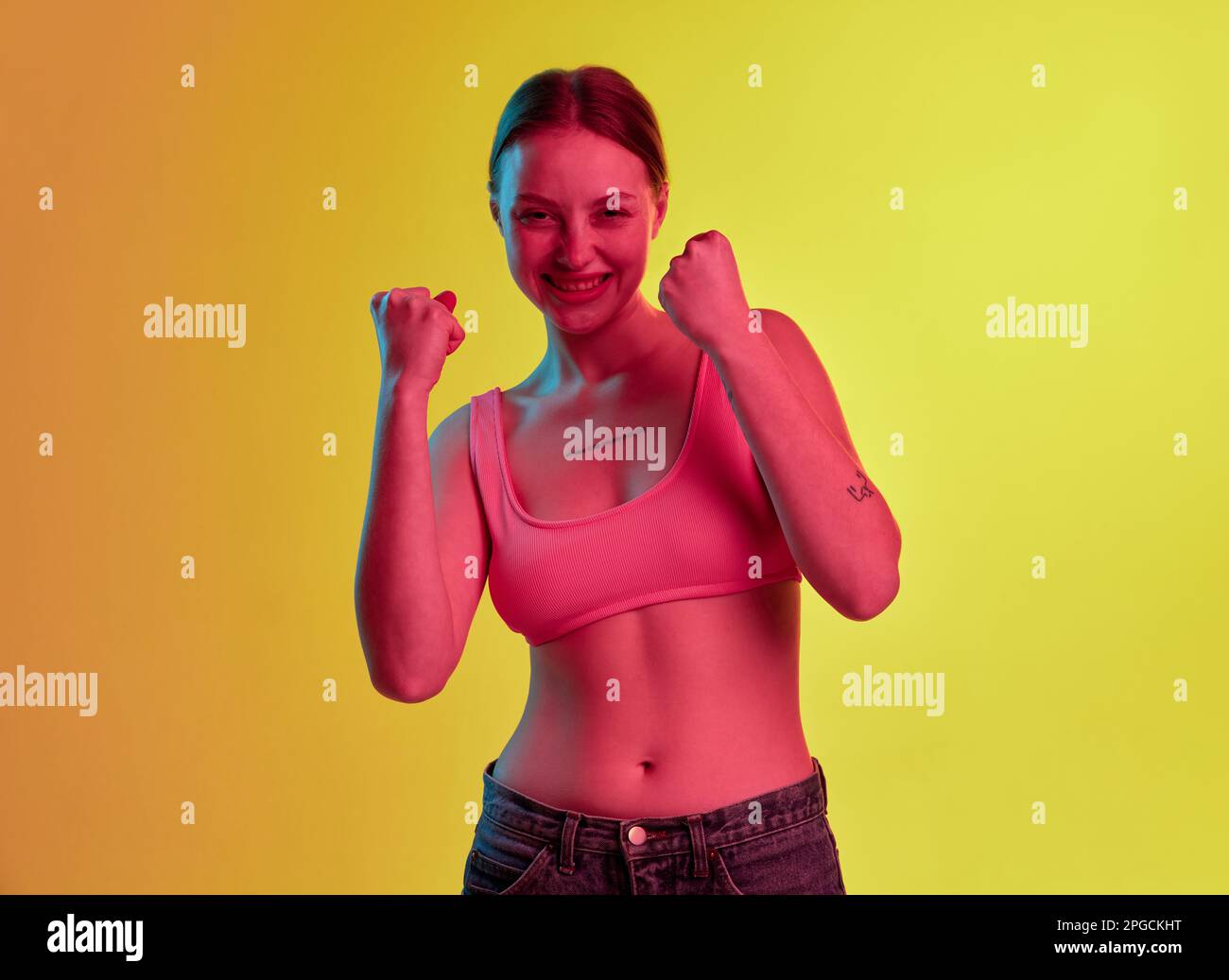 Positive young girl with pleasure face showing her win, victory over ...