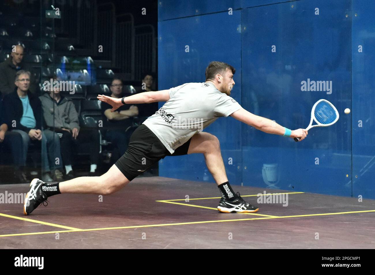 London, UK on 21 March 2023. Patrick Rooney (England) takes on Eain Yow ...