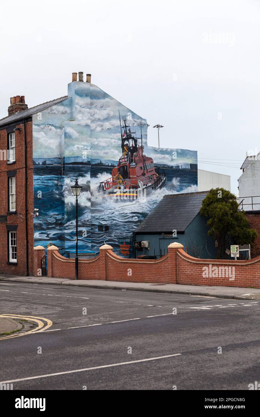 A stunning mural of a lifeboat at sea on the wall of the Ship Inn pub ...