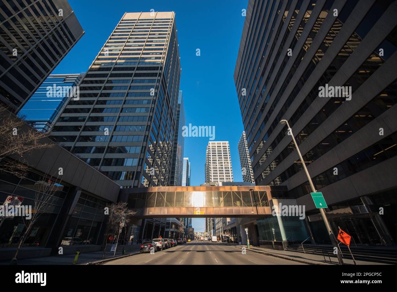 Asphalt road with contemporary high rise buildings with glass mirrored ...
