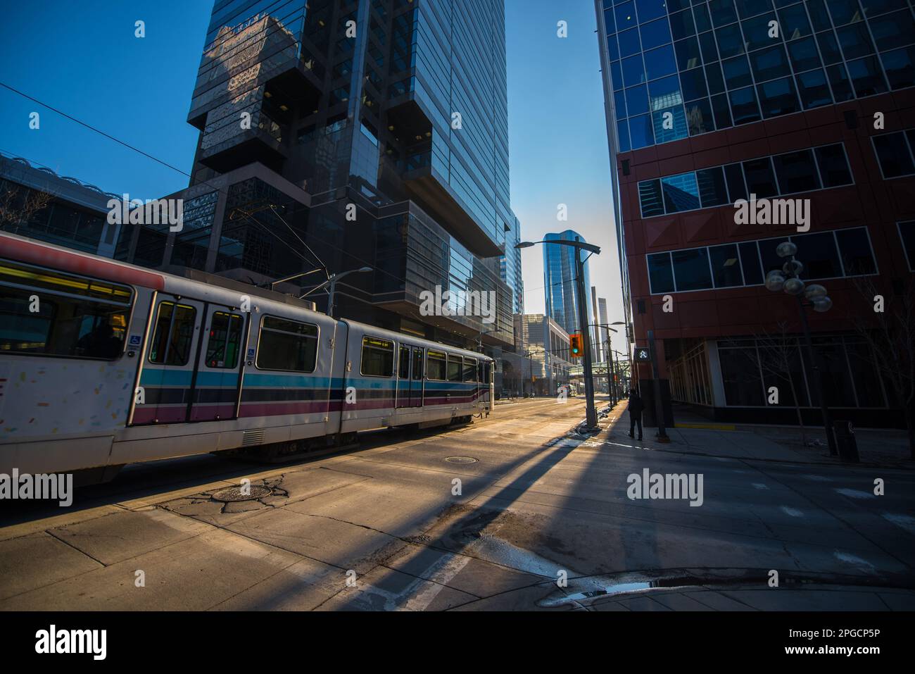 Urban public rail transport in Calgary city street running between ...