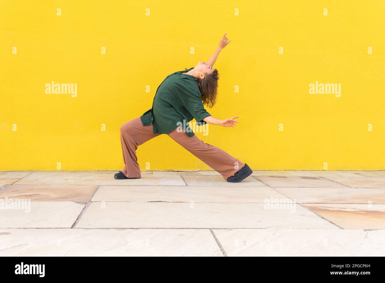 Full body of unrecognizable female wearing casual outfit bending back ...