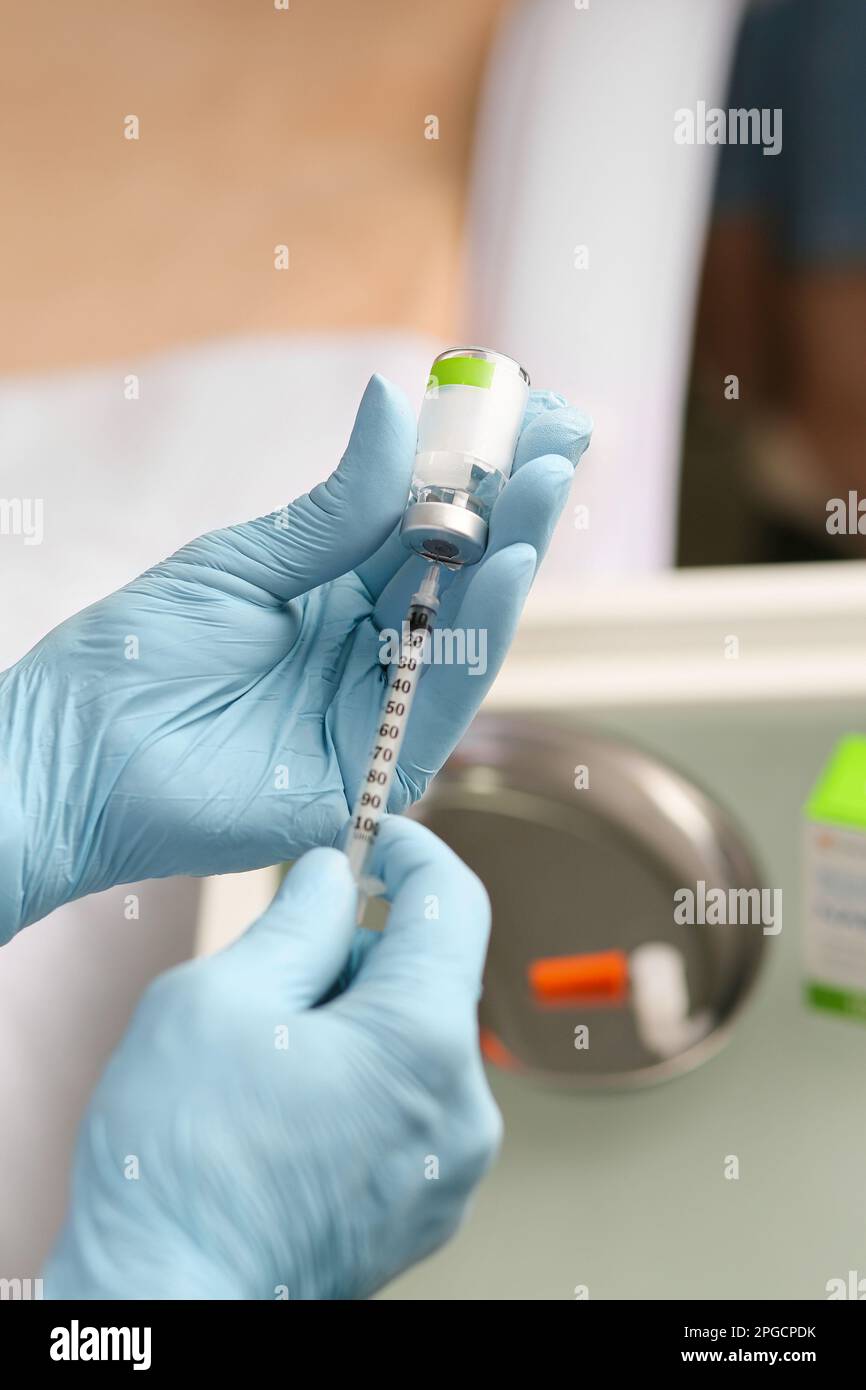 Syringe in the hands of a beautician. Aesthetic cosmetology. Hands in ...