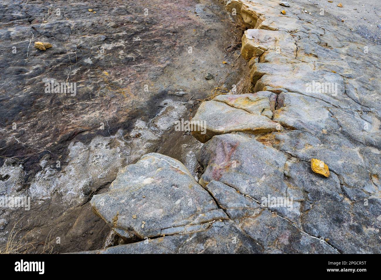 Top view of rough landscape with uneven surface and stones with black ...