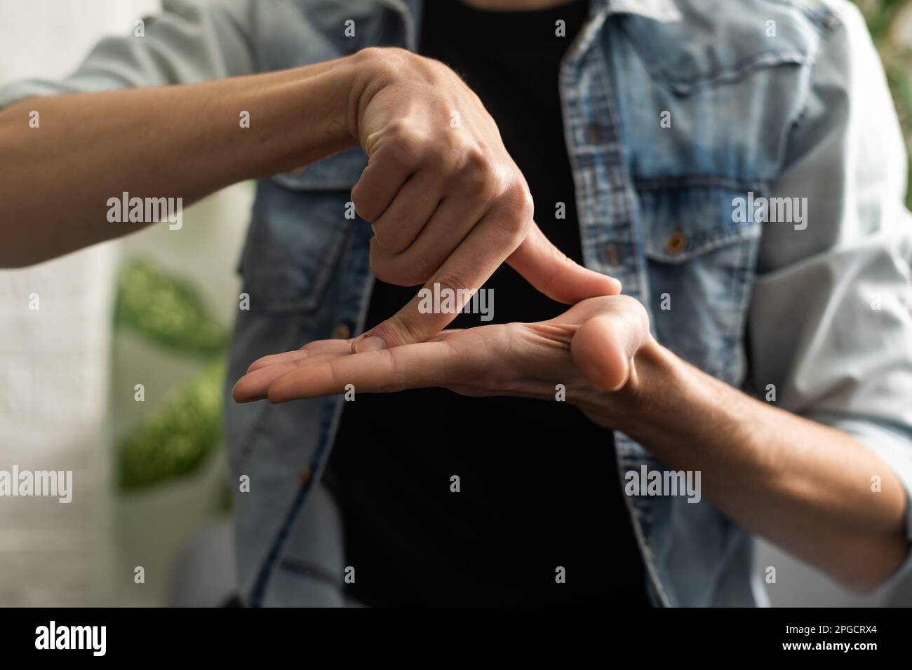 Man Using Sign Language To Communicate At Home Stock Photo - Alamy