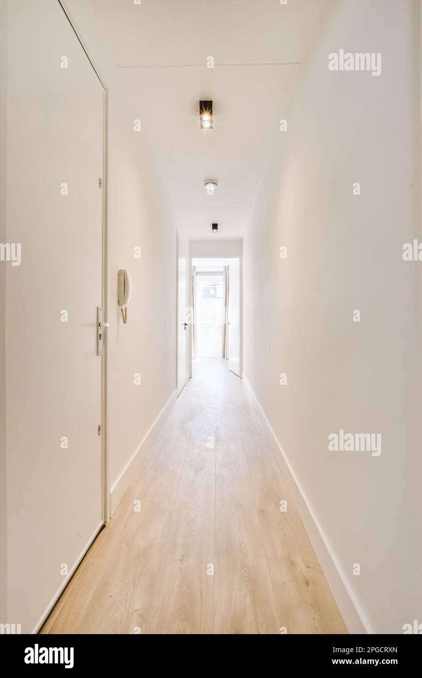 Interior design of empty hallway with white walls and wooden floor ...