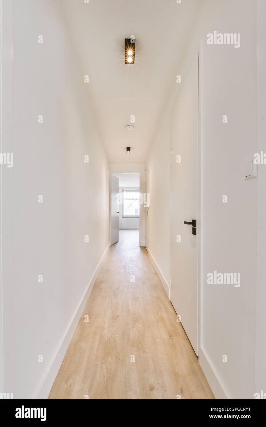 Interior design of empty hallway with white walls and wooden floor ...