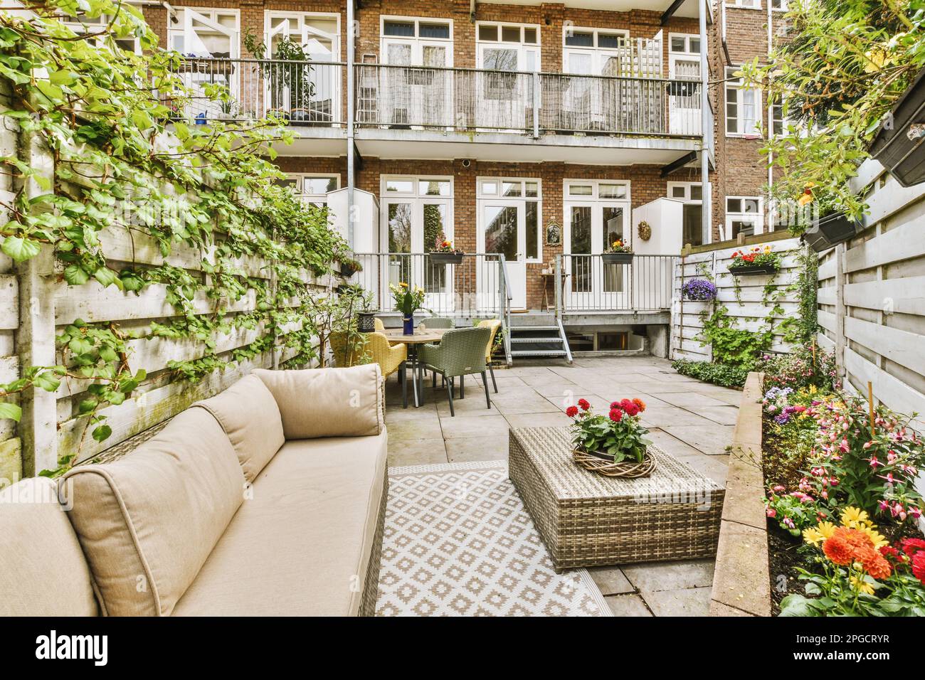 Exterior design of terrace with garden flower plants on fence and ...