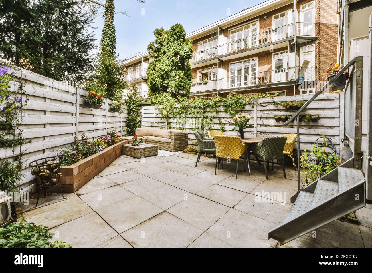 Exterior design of terrace with garden flower plants on fence and ...