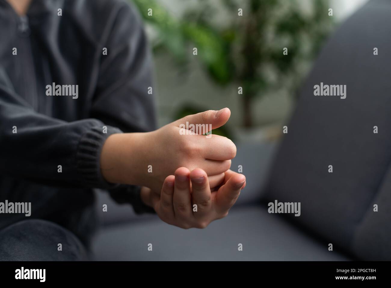 Beautiful smiling deaf girl using sign language Stock Photo - Alamy